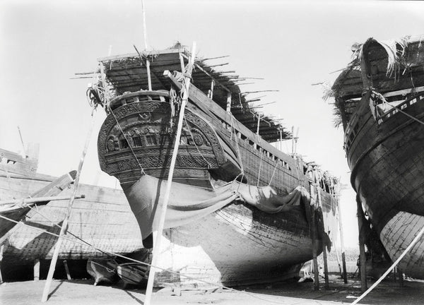 Stern quarter view of a fine baggala drawn up on the Kuwait waterfront ...